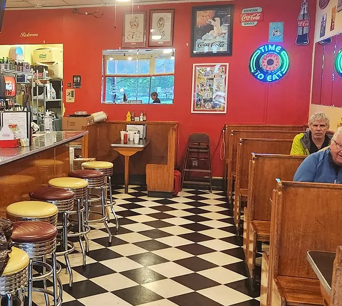 Step inside and the checkerboard floor announces you've entered the diner dimension, where neon signs glow and vinyl booths await your stories.