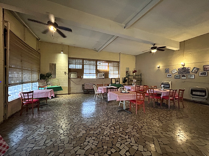 Red checkered tablecloths and simple furnishings set the stage where barbecue, not décor, rightfully remains the star of the show.