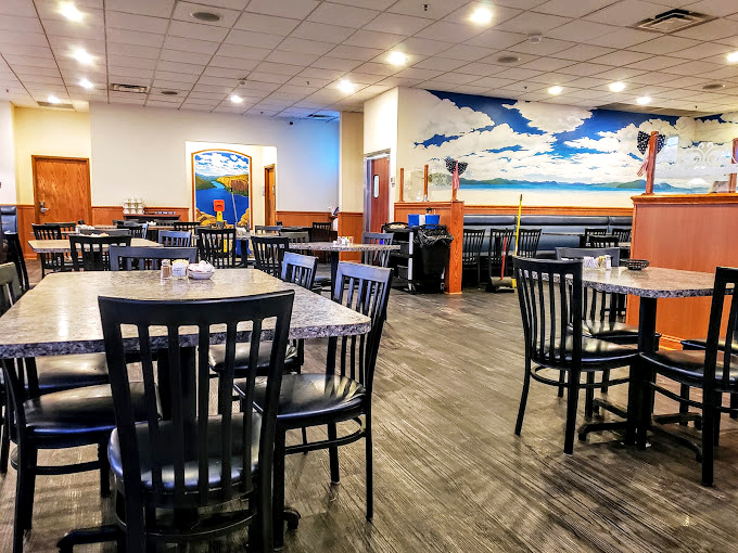 Where blue skies meet comfort food dreams. The mural adds a touch of whimsy to this unpretentious dining room where memories are made.