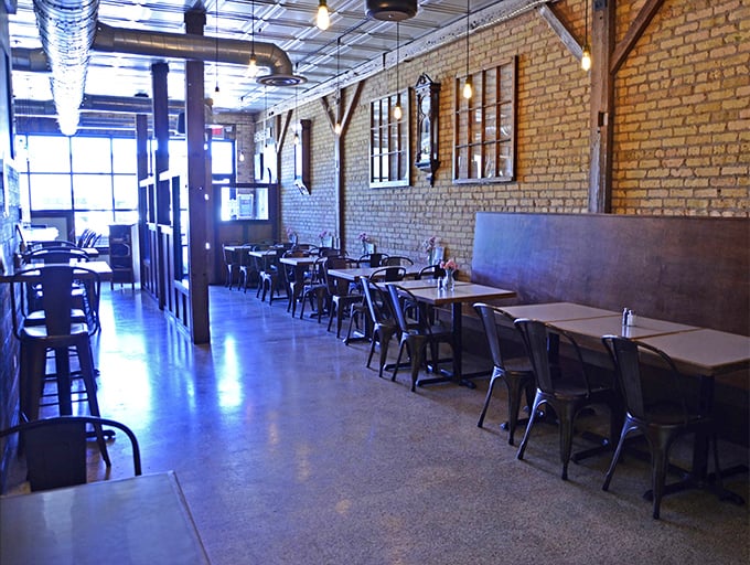 Industrial-chic meets small-town charm in this dining room where exposed brick walls tell stories while you create new ones.