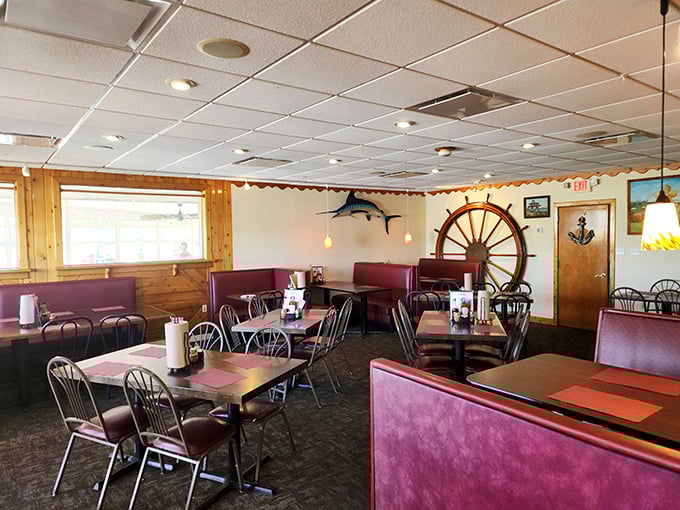 Nautical charm meets cozy comfort inside Meding's dining room. That ship's wheel isn't just decoration—it's steering you toward crab cake nirvana.
