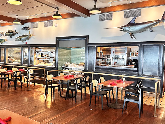 Inside, mounted fish keep watchful eyes on diners enjoying their formerly swimming brethren. The warm wood and open kitchen create that perfect "fancy but not fussy" vibe.