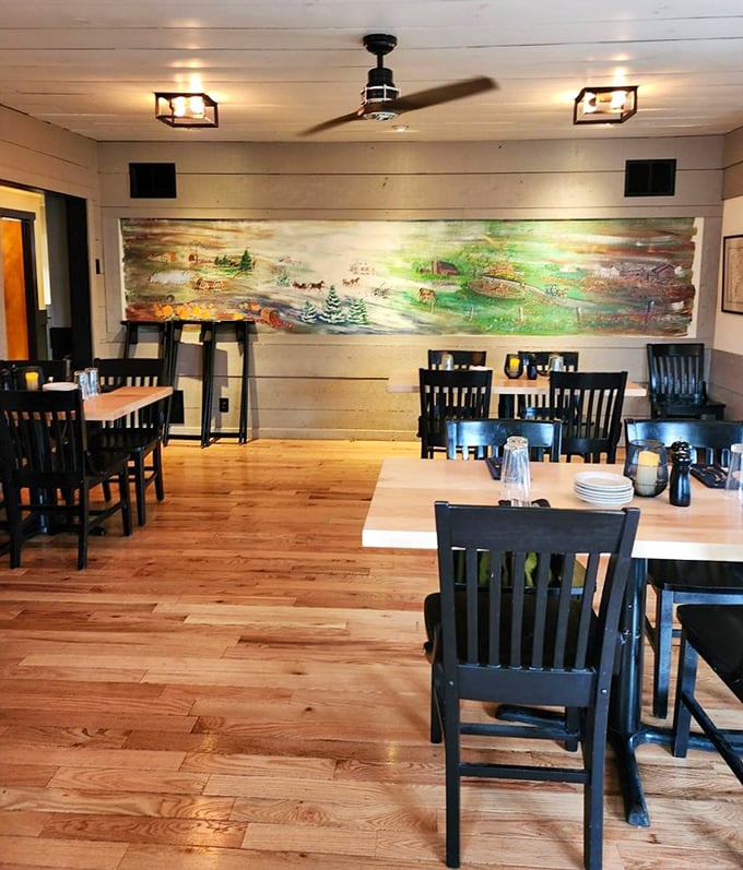Rustic wooden floors and a pastoral mural create the perfect backdrop for culinary memories. Like stepping into your favorite aunt's dining room—if she could cook like a master chef.