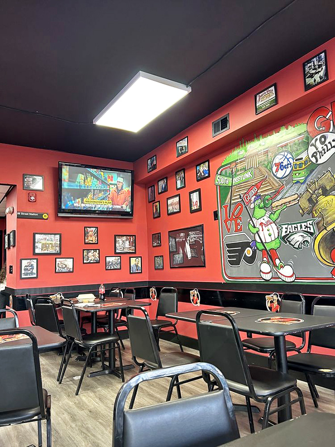 Those red walls and sports murals create the perfect backdrop for your cheesesteak pilgrimage – pure Philadelphia pride on display.