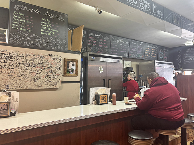 Decades of satisfied customers have left their mark on that signature board, while the chalkboard menu promises timeless comfort.