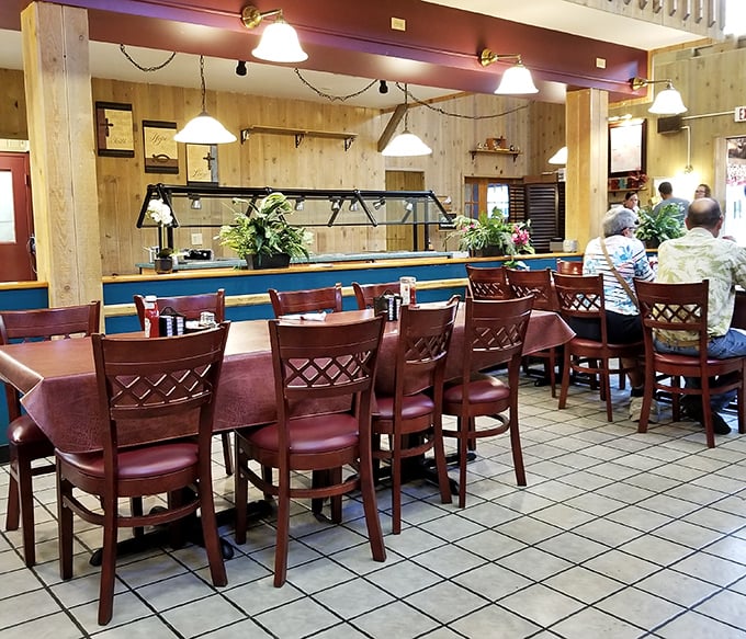 Simple wooden chairs and warm paneling create that quintessential Pennsylvania Dutch dining experience—comfort before the comfort food arrives.