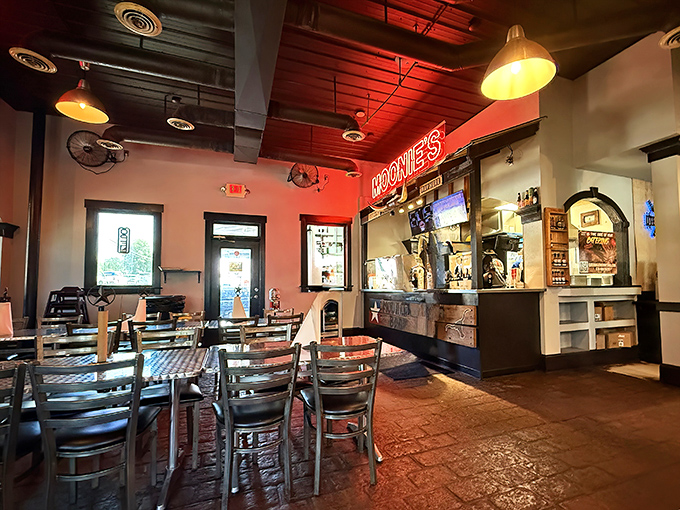 Red neon casts a warm glow over brick floors and metal chairs – no pretension, just the promise of meat-centric bliss ahead.