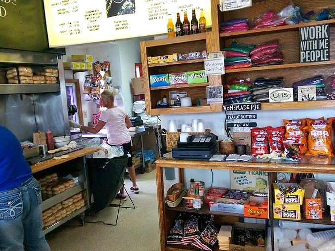 Inside this time capsule of American dining, every inch tells a story – from the candy display to the stacks of buns awaiting transformation.