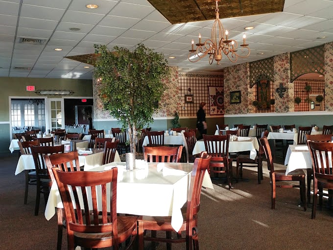 This dining room whispers "Sunday dinner at grandma's" but with better lighting and no plastic-covered furniture.