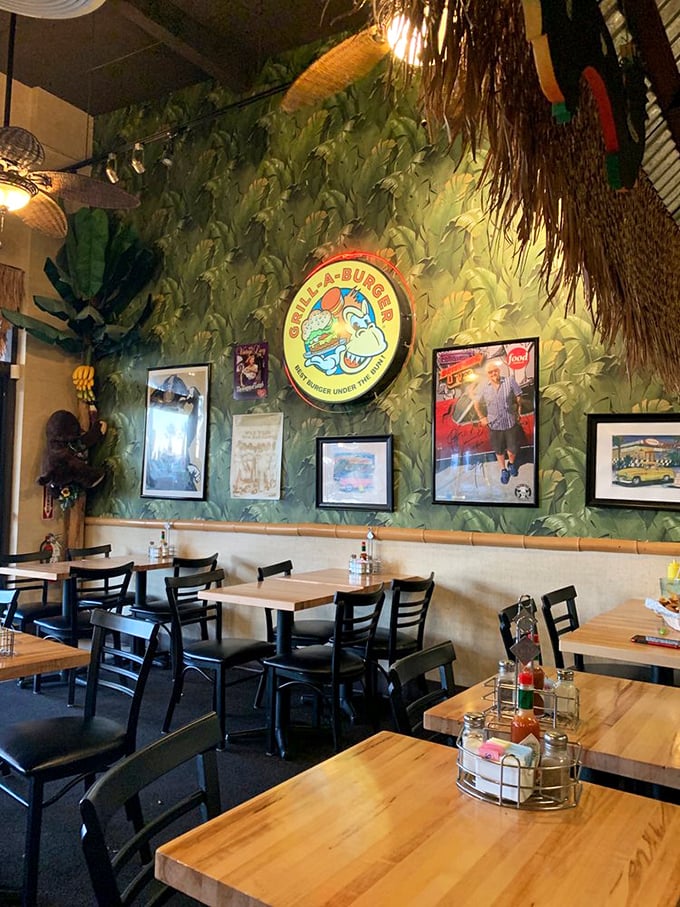 Tropical paradise meets burger joint. The leafy green walls and thatched decor transport you far from the desert, creating a vacation vibe before your food even arrives.