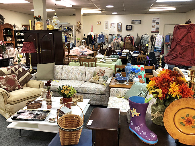 A living room tableau that tells a hundred stories—floral couches, vintage tables, and decorative touches waiting to begin their second acts in someone's home.