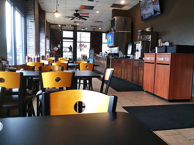 Inside, yellow chairs and wooden tables create the perfect no-nonsense setting for the serious business of barbecue consumption—function beautifully following form.