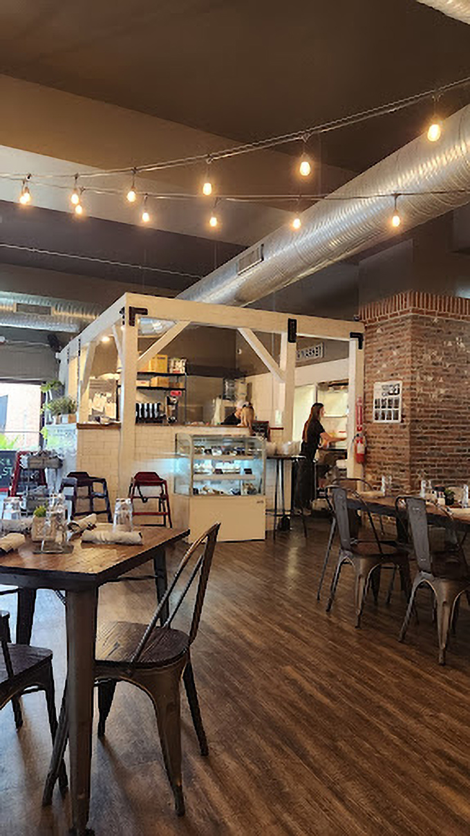 Step inside where exposed brick meets modern comfort, creating the perfect backdrop for serious comfort food conversations.