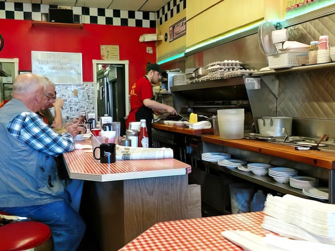 Red vinyl stools and checkered floors create the perfect stage for burger magic to unfold.