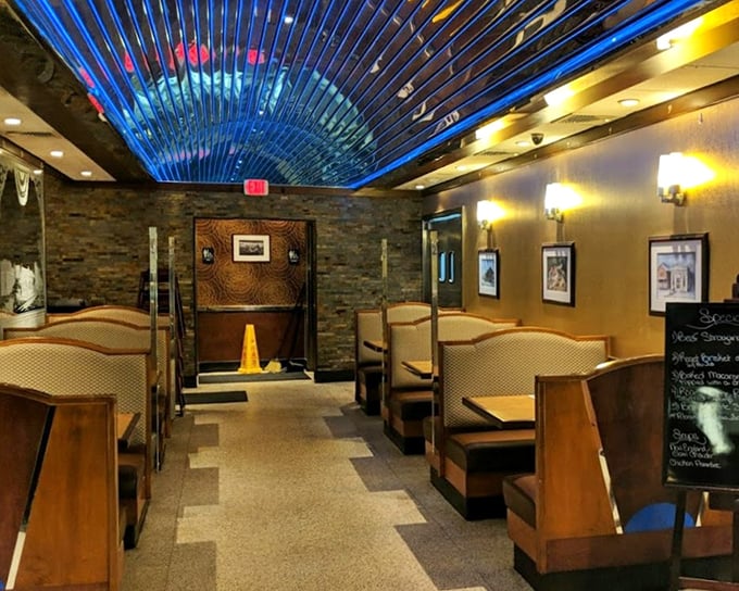 Step inside to discover the diner's signature blue ceiling and warm wooden booths—architectural proof that someone understood exactly what "cozy" should feel like. 