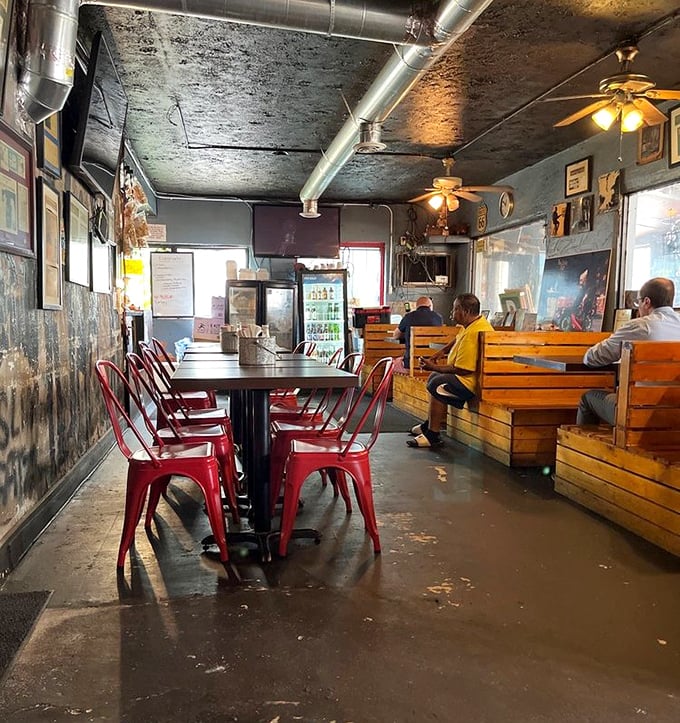 Red chairs against weathered walls tell stories of countless BBQ pilgrimages. The patina here isn't decoration – it's history.