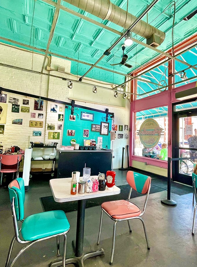 Retro diner vibes meet modern comfort in a space where turquoise dreams and coral wishes come deliciously true.