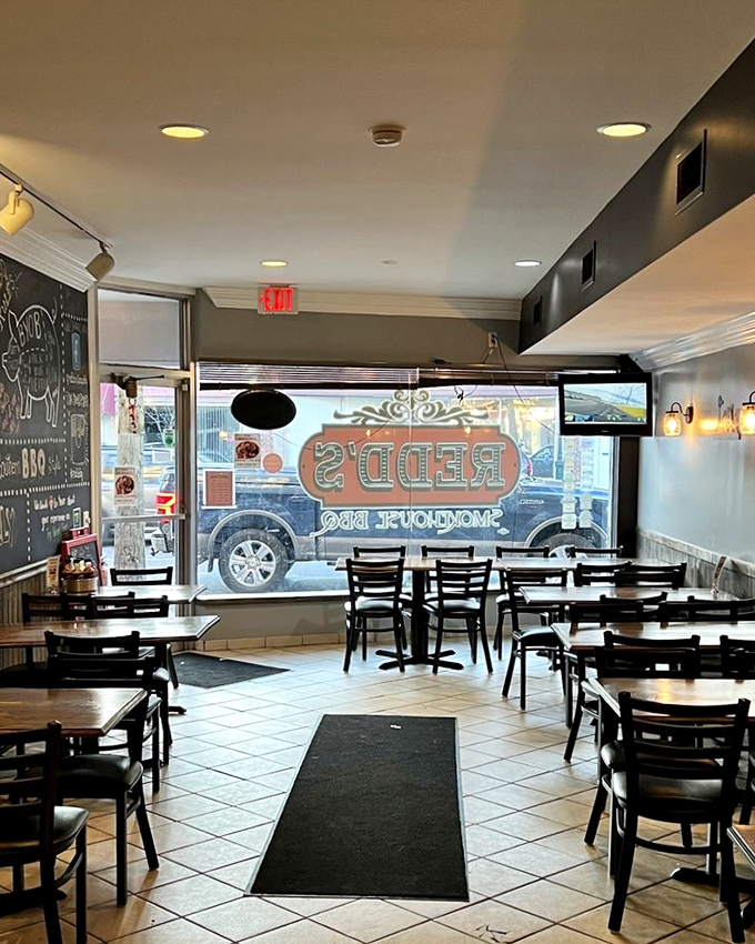 Simple tables, tile floors, and a chalkboard menu—Redd's interior says, "We're not here to impress you with chandeliers; we're here to change your life with brisket."