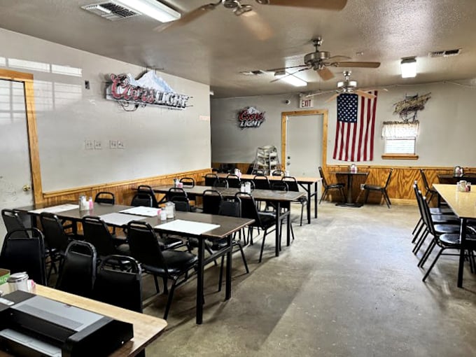 No-frills dining at its finest – wood paneling, simple tables, and an American flag that reminds you this is quintessential small-town Texas