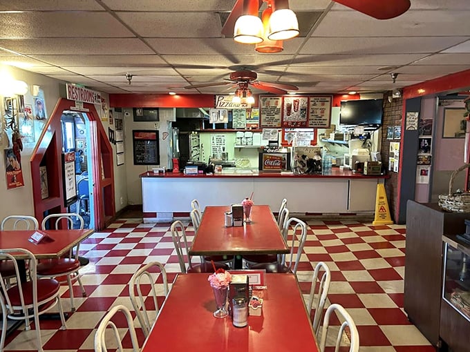 Classic red and white checkerboard floors set the stage for a genuine 50's experience. This isn't manufactured nostalgia—it's authentic Americana.