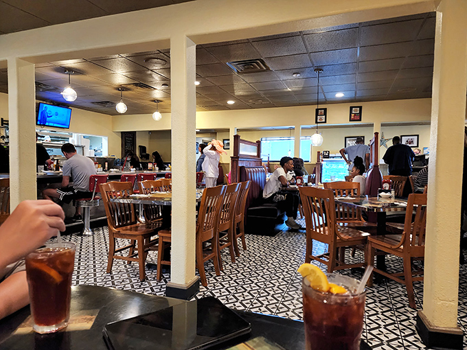Inside Trip's, the classic black and white tile floor sets the stage for breakfast theater, where iced tea is the opening act and pancakes are the headliner.