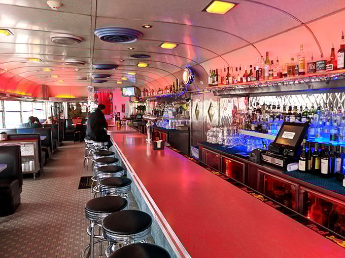 Step inside and you're transported to diner heaven—curved ceiling, red counter, and a bar that glows with possibility like the jukebox of your dreams.