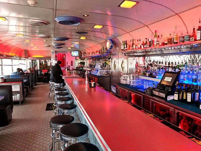 Step inside and you're transported to diner heaven—curved ceiling, red counter, and a bar that glows with possibility like the jukebox of your dreams.