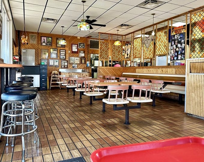 Step inside and time travel to a simpler era—wood paneling, fixed swivel seats, and memorabilia that tells the story of Orlando's beloved beef sanctuary.
