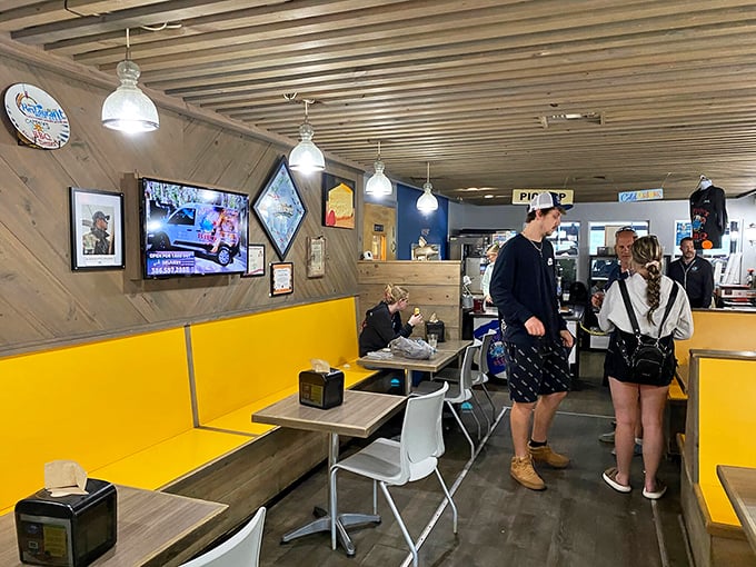 Inside, bright yellow bench seating and wood-paneled walls create the perfect casual backdrop for the serious business of barbecue consumption.