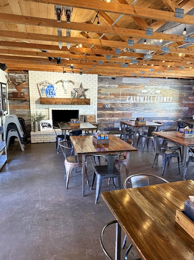 Exposed wooden beams and reclaimed wood walls create the perfect rustic backdrop for meat-induced euphoria. This isn't décor—it's a temple to Texas tradition.