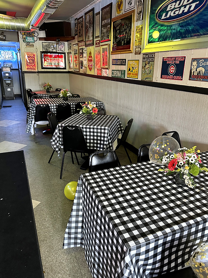 Classic black and white checkered tablecloths set against walls adorned with vintage memorabilia – dining here feels like a warm hug from your favorite aunt.
