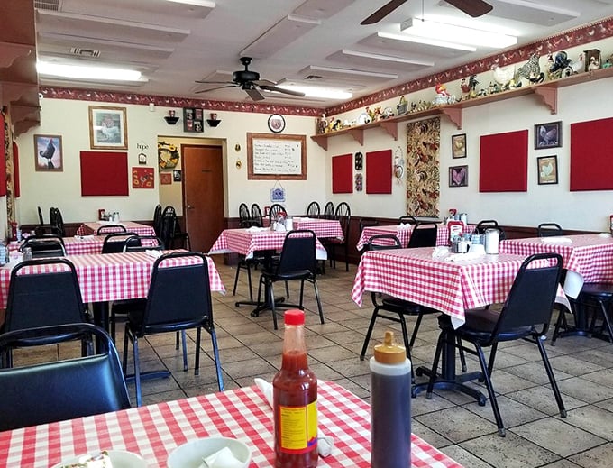 Red checkered tablecloths and rooster décor create the perfect farmhouse atmosphere for serious comfort food.
