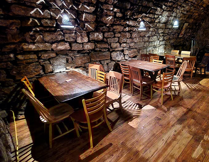 Where limestone walls tell stories and wooden chairs have welcomed generations of thirsty visitors. This isn't décor—it's history you can touch.