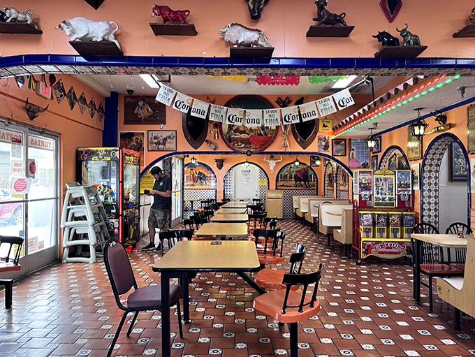 Step inside and you're transported straight to Mexico, with vibrant orange walls, bullfighting memorabilia, and Corona banners creating an atmosphere as authentic as the food.