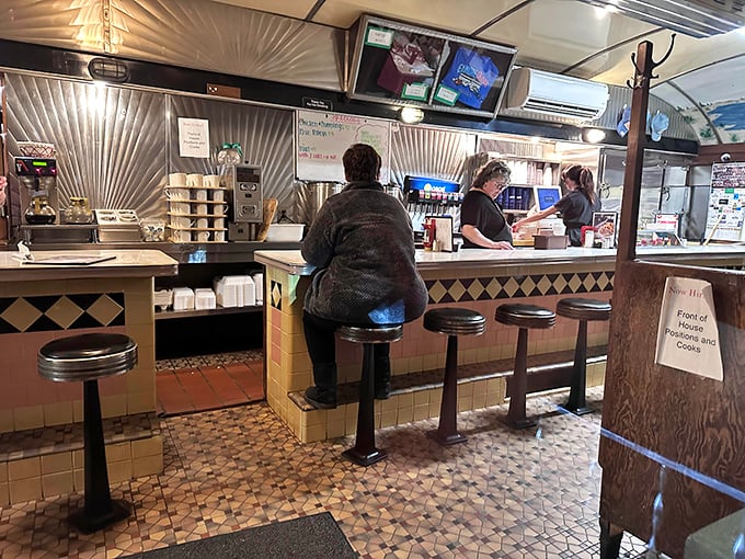Counter culture at its finest—where spinning stools and checkered floors set the stage for breakfast theater that's been running for decades.