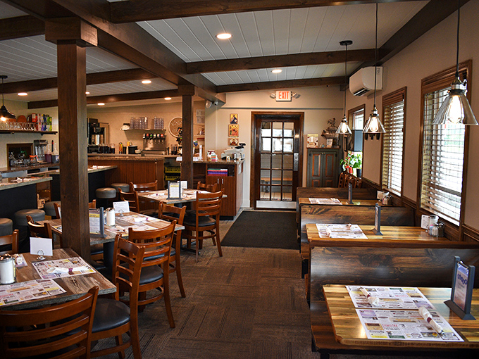 Wooden beams, warm lighting, and tables set for hungry patrons—this isn't interior design, it's a hug in restaurant form.