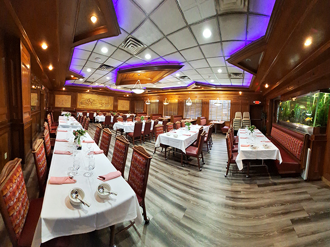 White tablecloths meet diner comfort in this elegant dining room. The blue accent lighting isn't just pretty—it's pointing you toward pancake paradise.