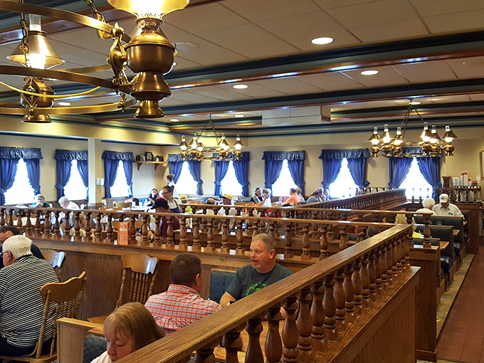 Wooden booths and blue curtains create the perfect backdrop for comfort food conversations—like Grandma's dining room, but with better pancakes.