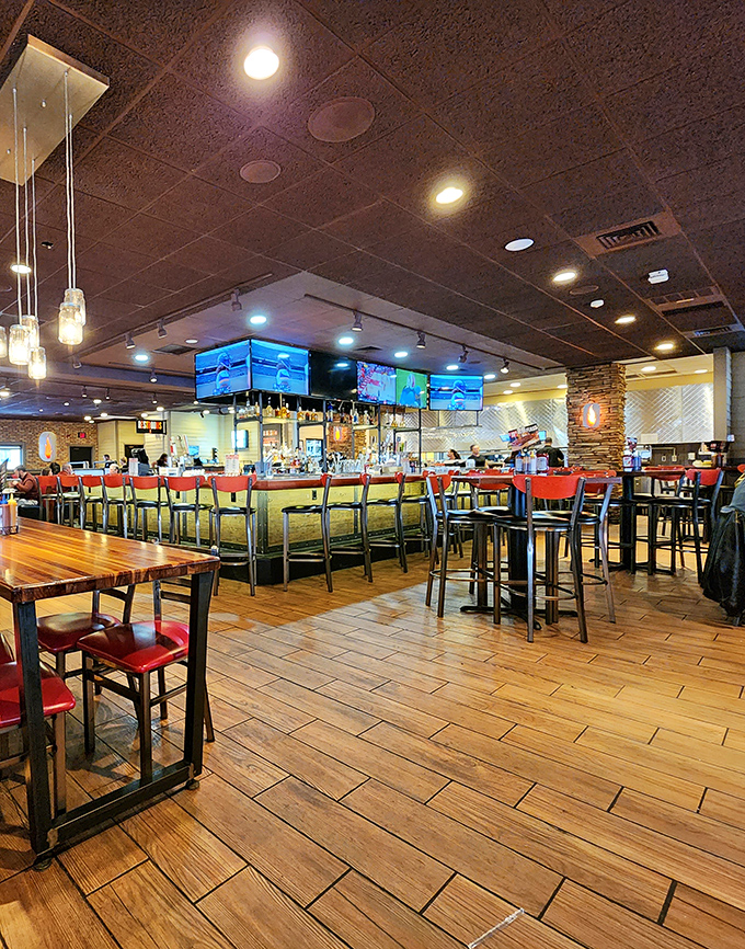Where sports fans and meat lovers unite under the warm glow of pendant lights. The bar's siren call says "stay awhile" even when your stomach says "I'm full."