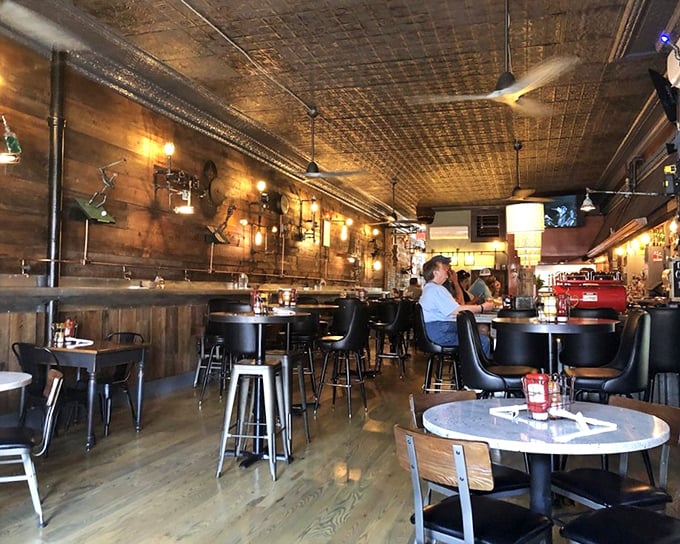 Step inside to discover a warm haven of pressed tin ceilings, Edison bulbs, and wood-paneled walls that feel like the living room of your coolest friend.