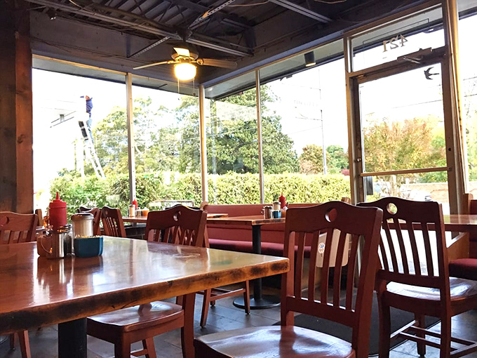 Sunlight streams through windows onto wooden tables where shrimp and grits dreams come gloriously true.