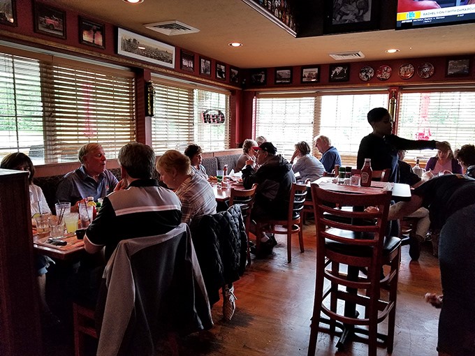 Inside, the warm wood tones and firefighter memorabilia create that rare atmosphere where strangers become friends and friends become family.