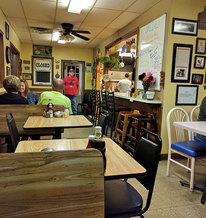 Inside, the warm yellow walls and mismatched furniture create that perfect small-town diner vibe where conversations flow as freely as the coffee.
