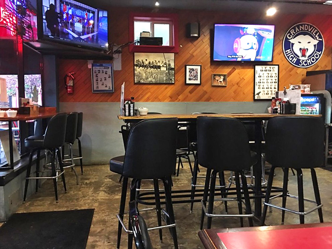Wood paneling meets local pride at the counter, where Grandview High School memorabilia reminds you this is a true neighborhood institution.
