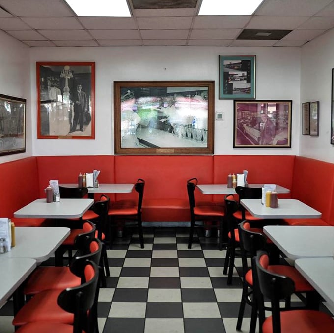 Classic diner aesthetics done right—red vinyl booths, checkered floors, and history on the walls. This isn't manufactured nostalgia; it's the real deal.