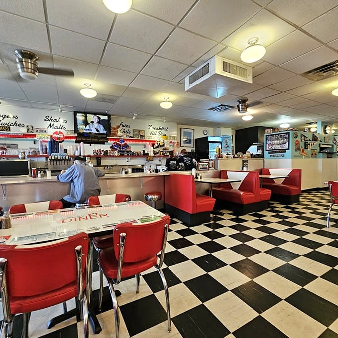 Step inside and time travel to the golden age of diners – red vinyl booths, checkerboard floors, and counter seating that practically begs you to order a second cup of coffee.