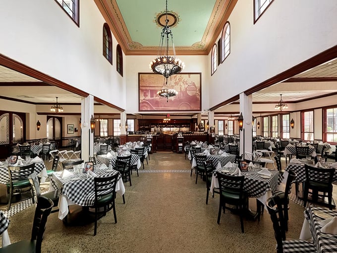 High ceilings, classic checkered tablecloths, and elegant chandeliers create a dining room that feels both grand and comfortably familiar—like a seafood cathedral.