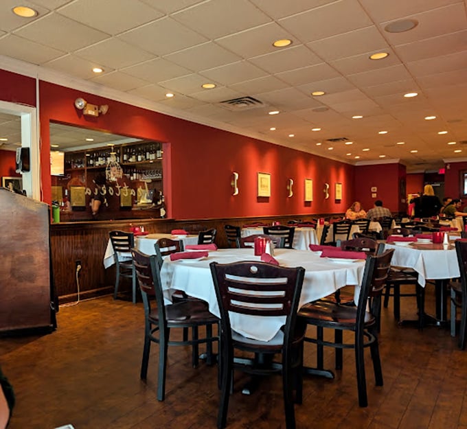 Rich burgundy walls and crisp white tablecloths create that perfect "fancy but not intimidating" vibe where both date nights and Tuesday dinners thrive.