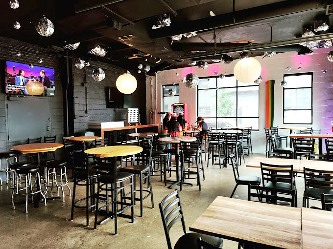 Disco balls and industrial chic create the perfect backdrop for pizza indulgence. This isn't just dining—it's dinner with a side of atmosphere.