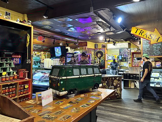 Step into organized chaos that somehow makes perfect sense. The vintage VW bus counter and eclectic décor create a vibe that's equal parts rock concert, antique shop, and BBQ heaven.